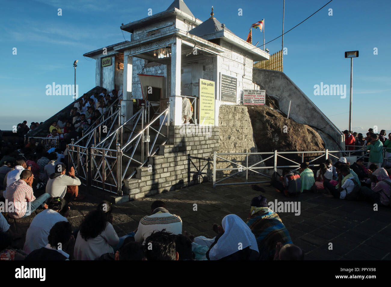 People worship at Buddhist temple on the summit of Adam's Peak, Sri ...