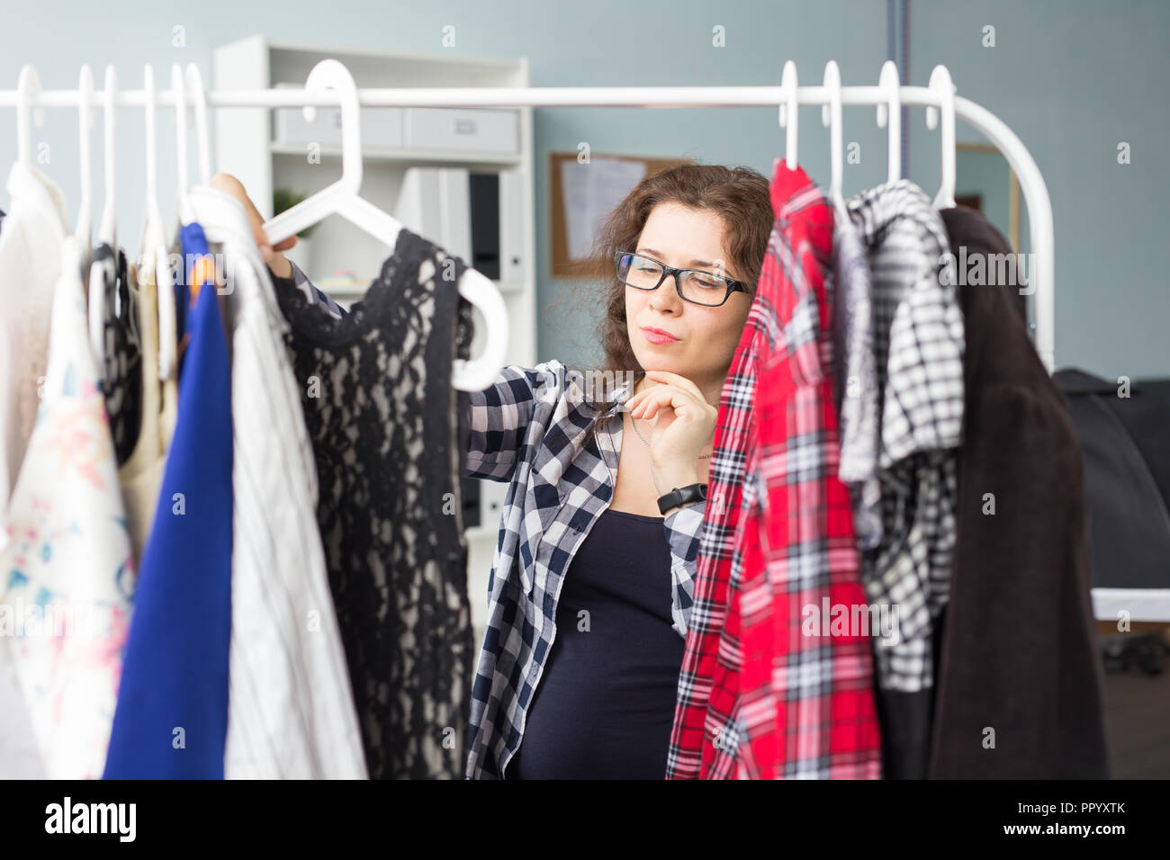 people, clothing and style concept - portrait of a pretty woman looking ...