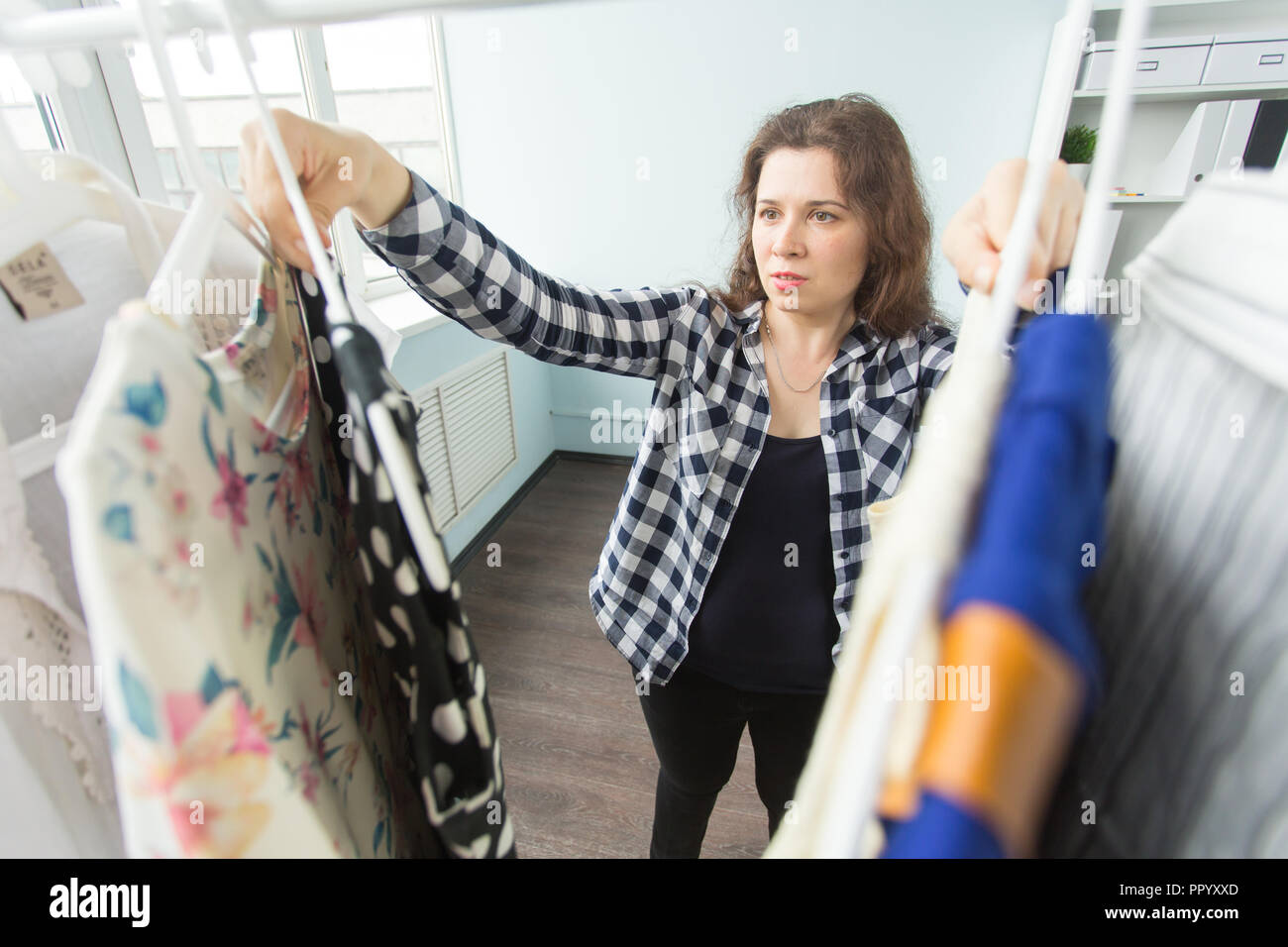 People, clothing and shopping concept - portrait of a pretty woman ...