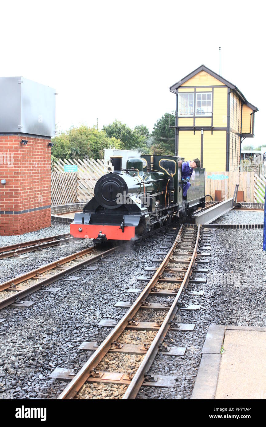 Small gauge steam train on turntable Stock Photo - Alamy