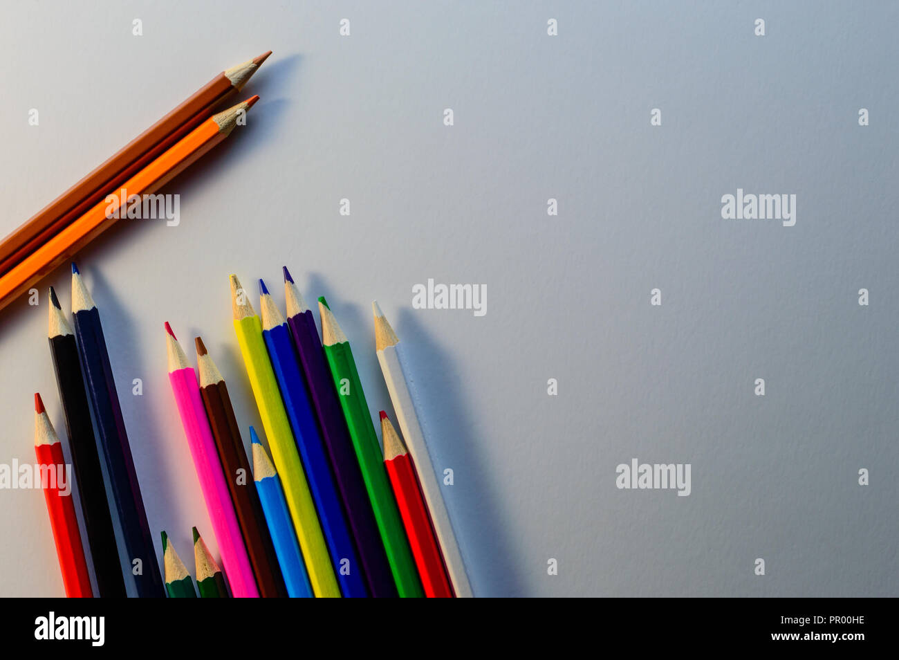Colored pencils on a clean sheet Stock Photo - Alamy