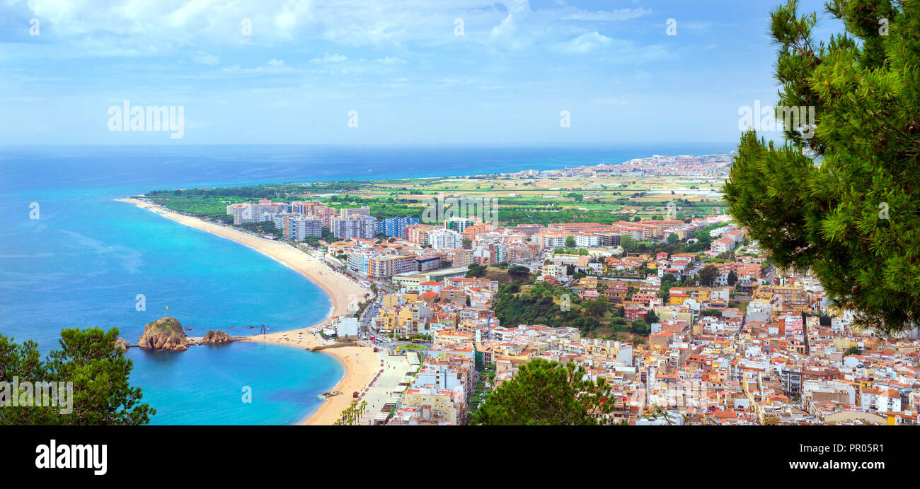 Spanish beach resort Blanes in summertime. Coast, rock Sa Palomera and ...
