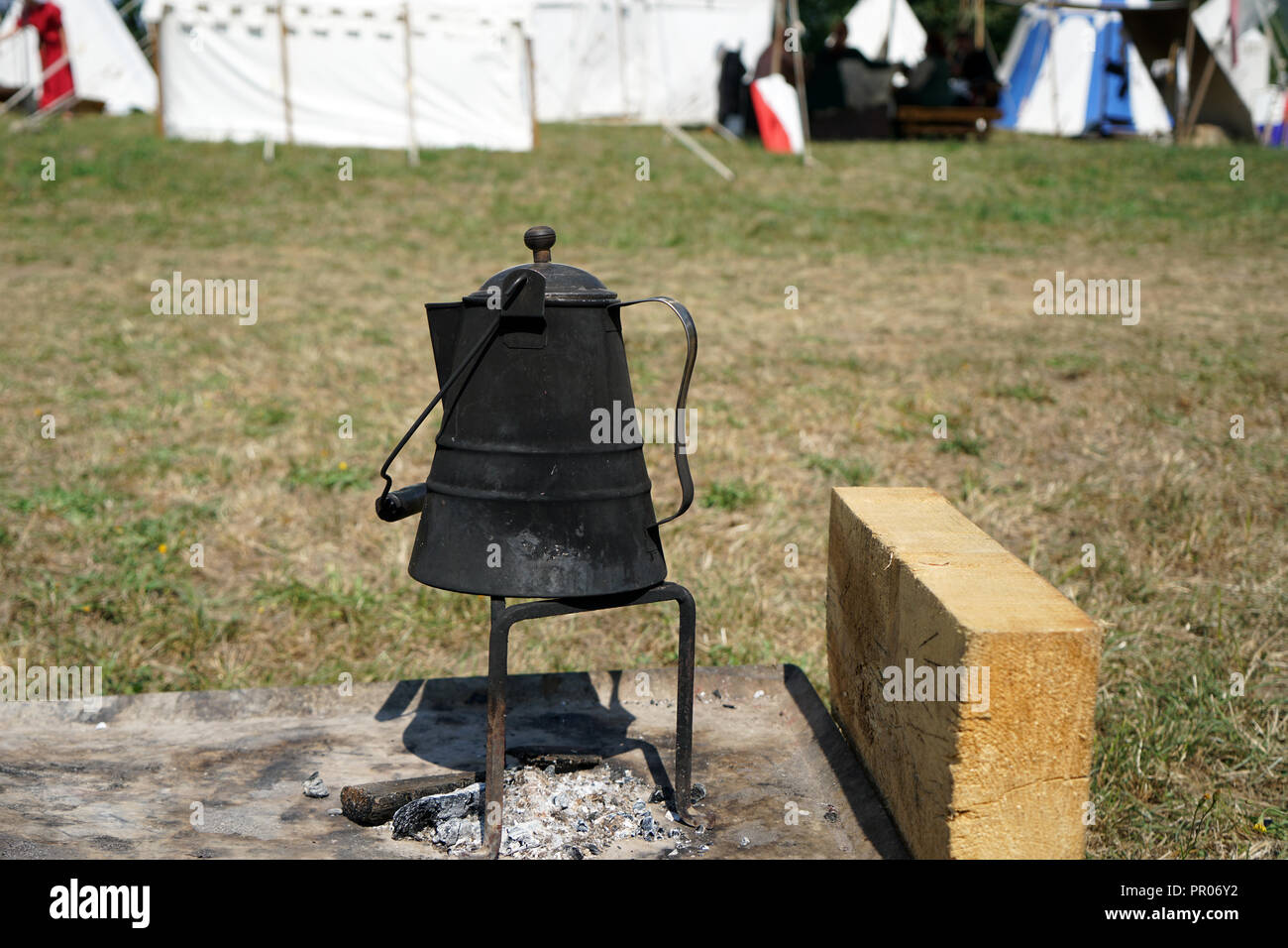 Primitive cooking on open flame with old pots and pans in Germany on a ...