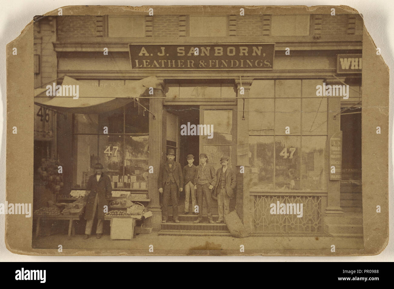 Five men posing in front of establishment of A.J. Sanborn, Leather ...