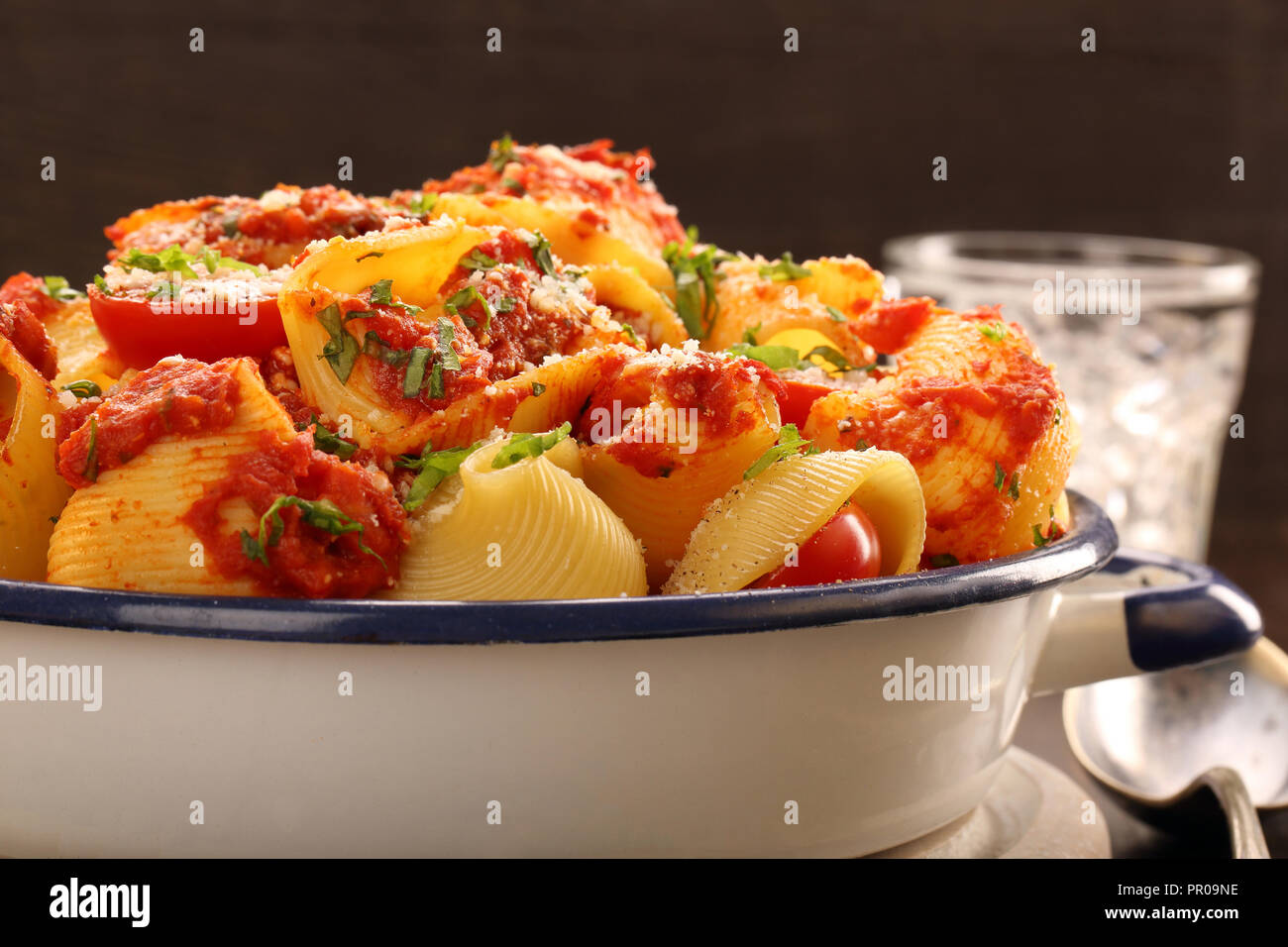 Lumaconi pasta with tomato sauce Stock Photo - Alamy