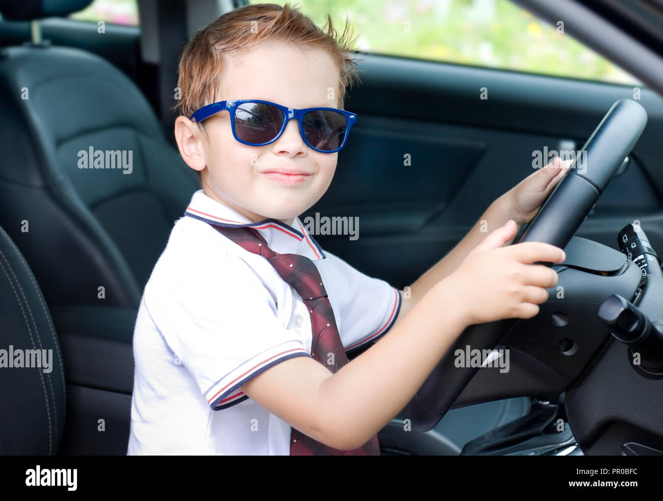 Cute driver in car Stock Photo - Alamy