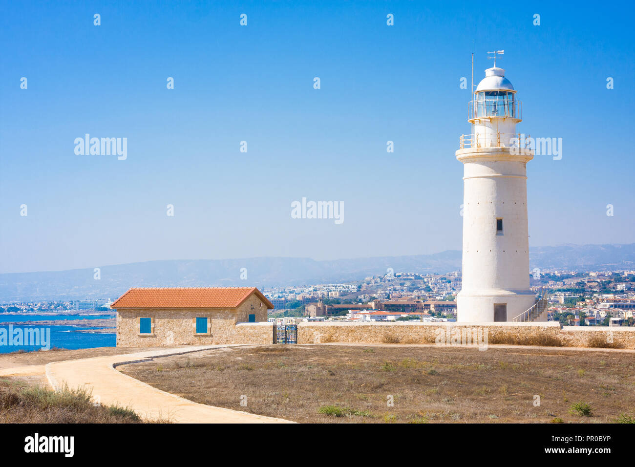 Old white lighthouse near the ancient ruins in Paphos Archaeological ...