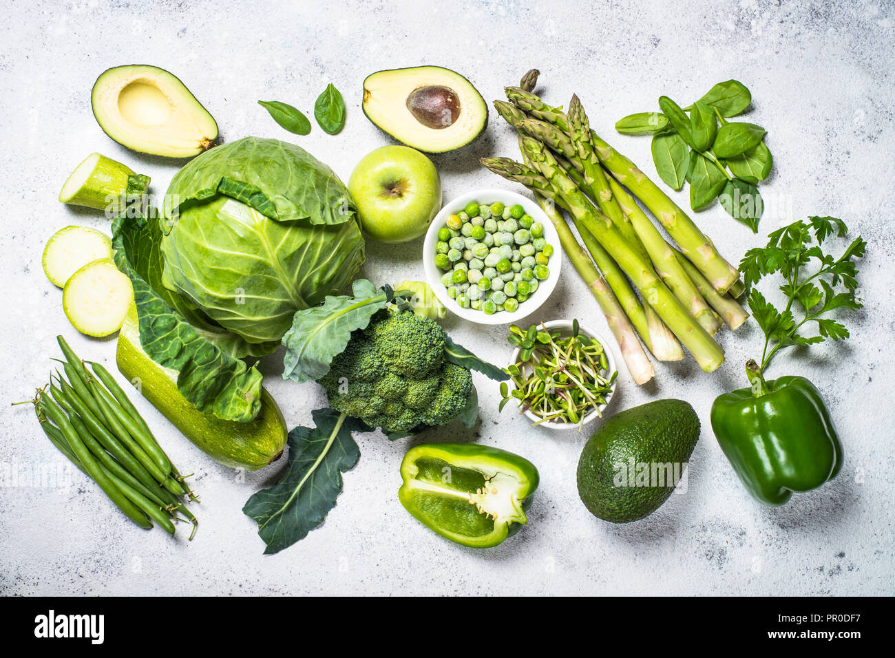 Green food assortment on light stone background Stock Photo - Alamy
