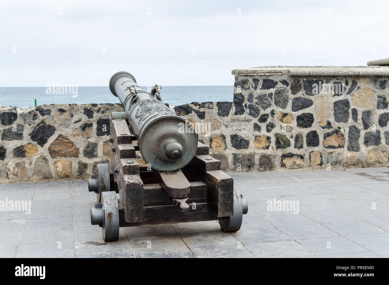old historic cannon in front of the harbour wall Stock Photo - Alamy