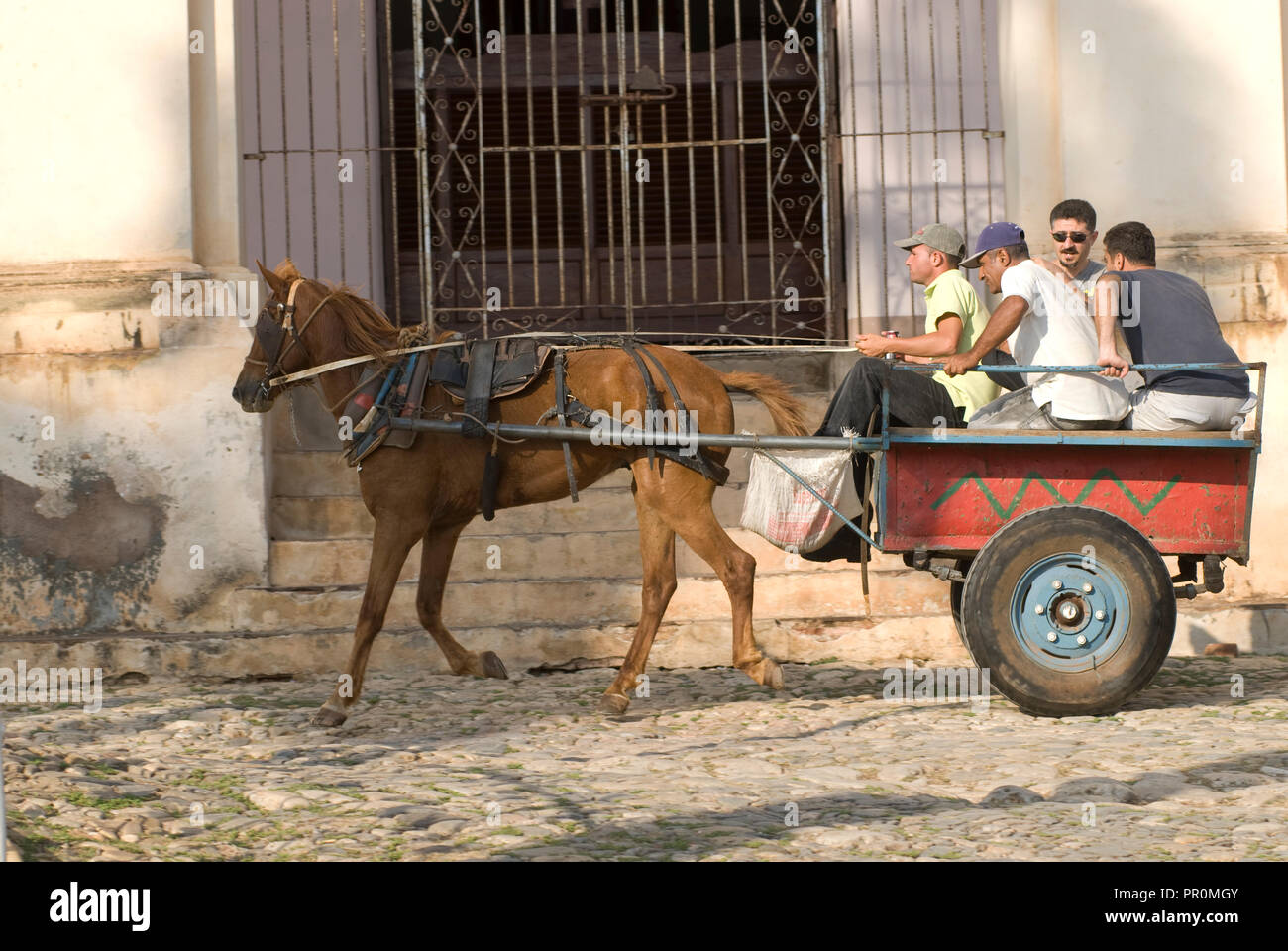 Horse and carriage loaded with locals in Trinidad Cuba Stock Photo - Alamy