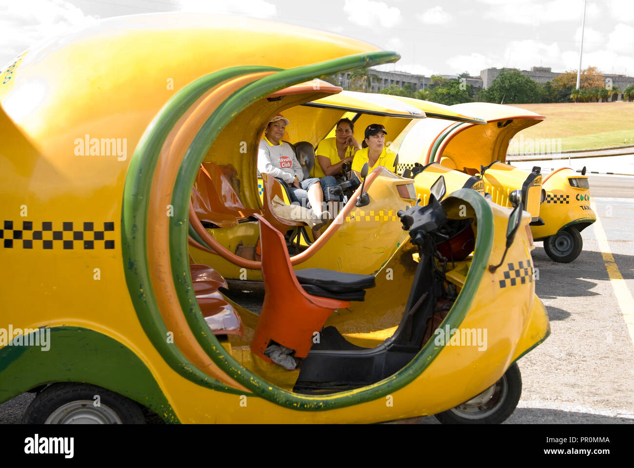 Yellow tuk tuk taxis waiting for their next clients La Habana Cuba ...