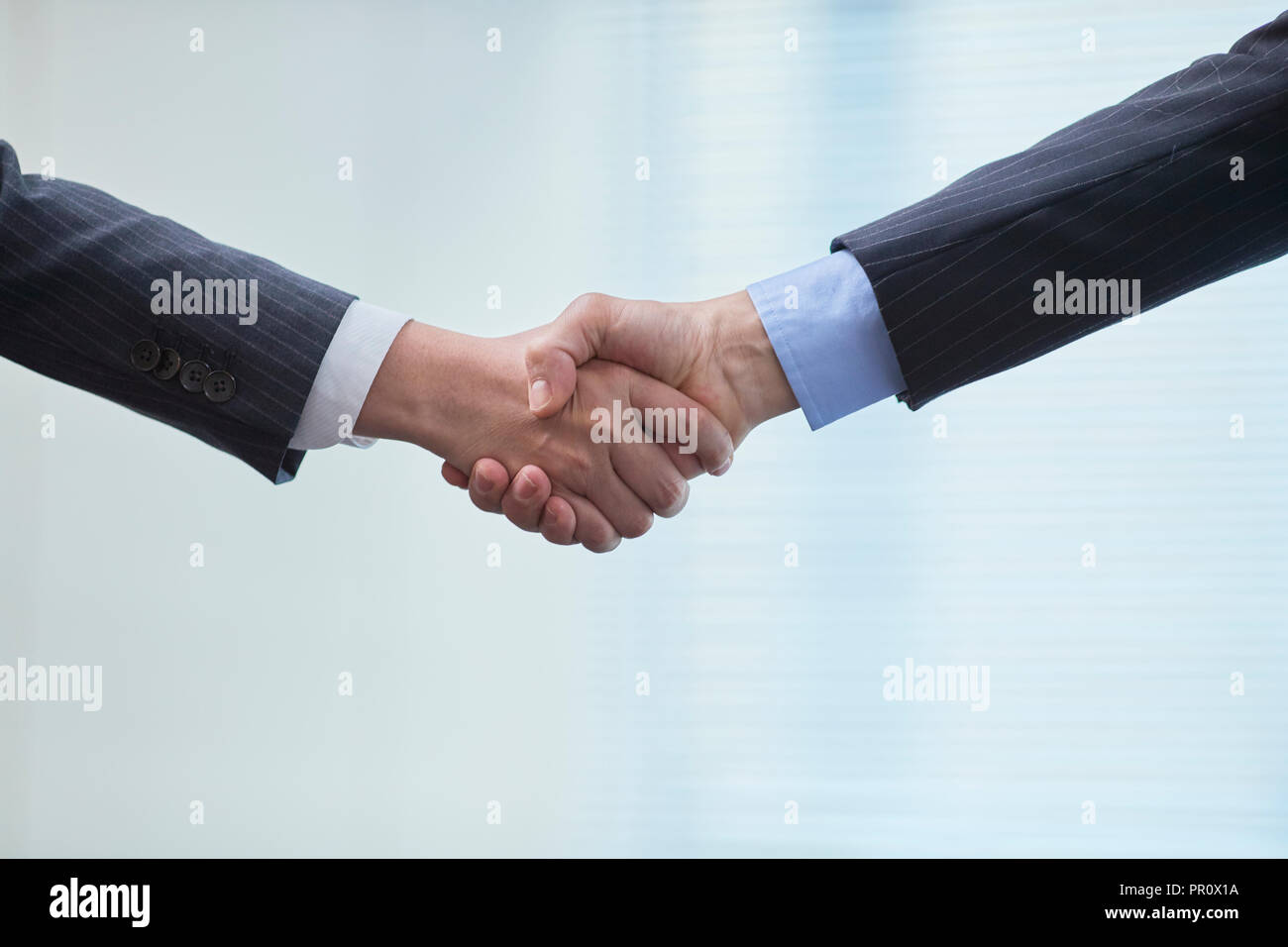 Japanese businesspeople shaking hands Stock Photo - Alamy
