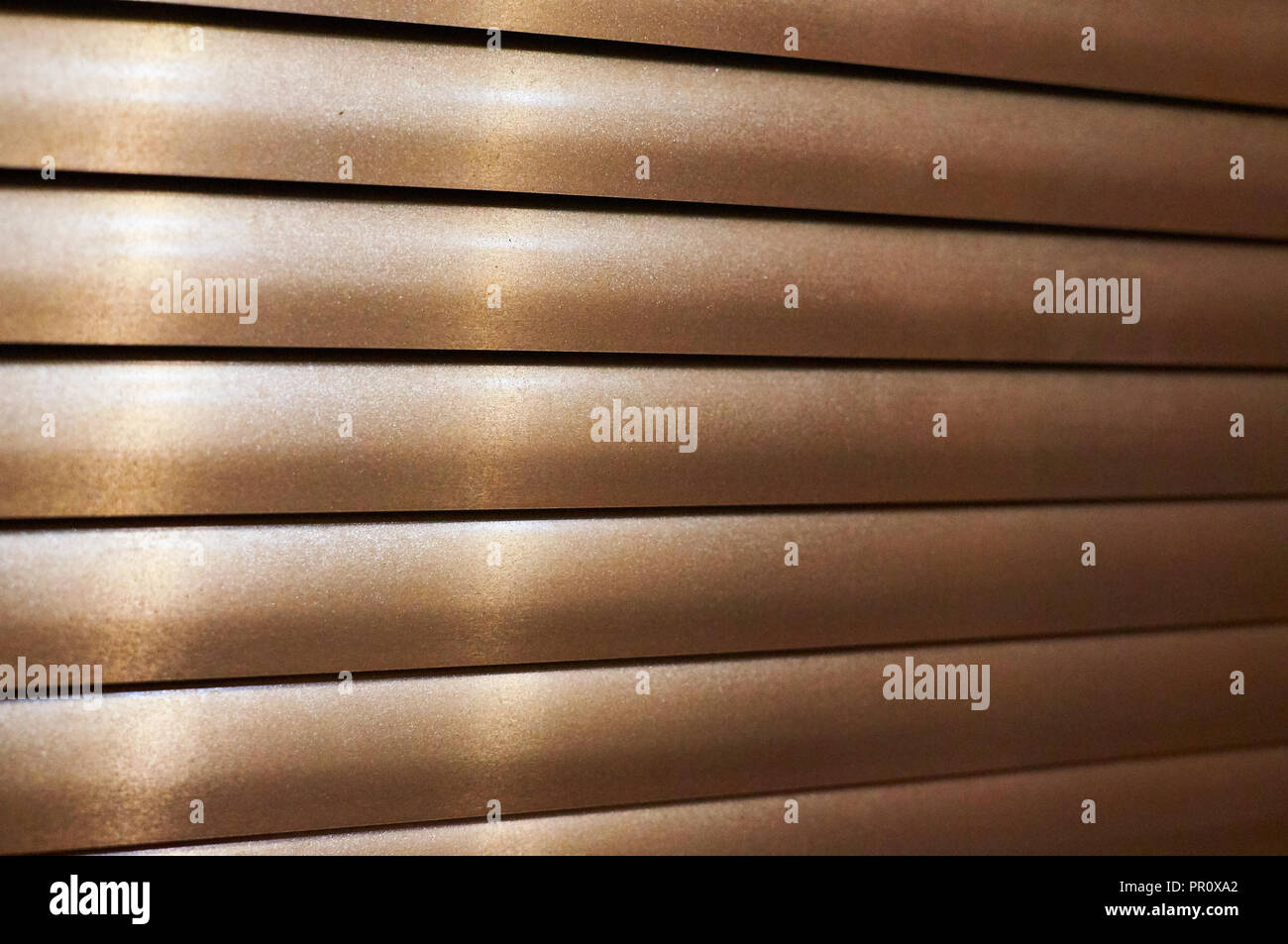 Metal shutters painted with gold paint. Abstract background Stock Photo ...