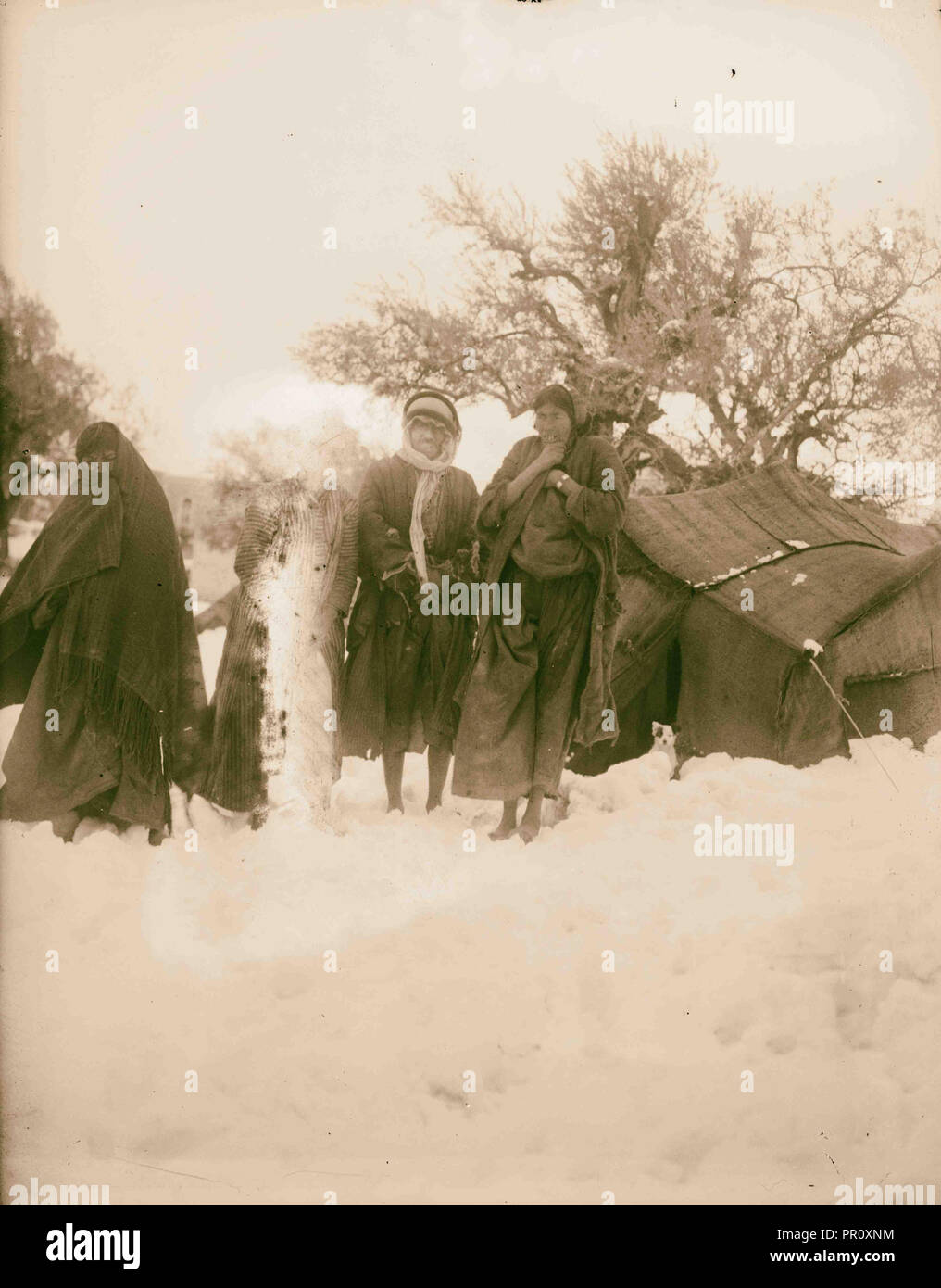 Snow in Jerusalem, 1921 Arab women in snow near tent. 1921, Jerusalem ...