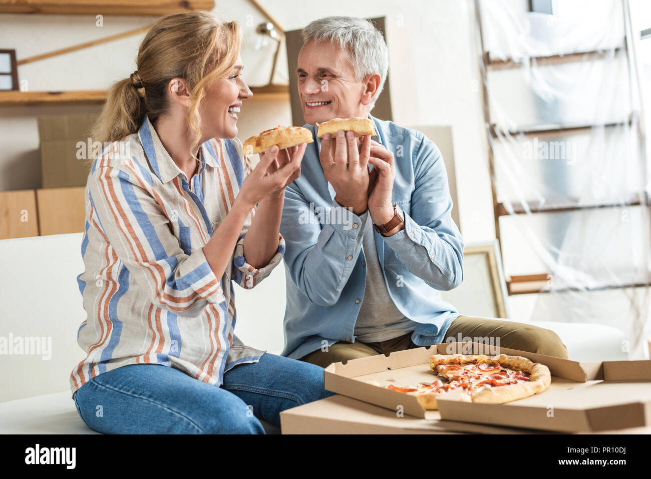 Old man eating pizza hi-res stock photography and images - Alamy