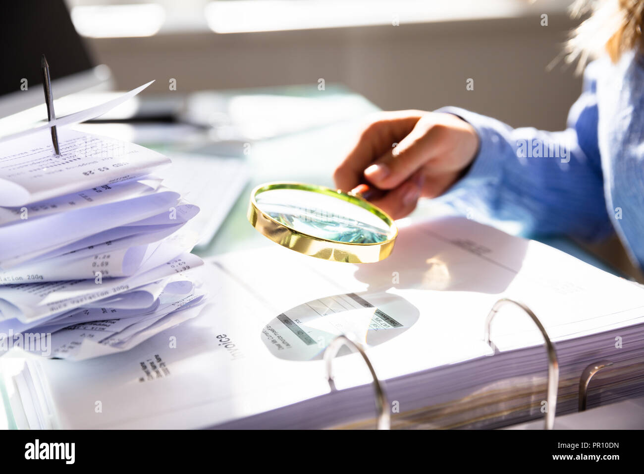Close-up Of A Businesswoman's Hand Checking Invoice With Magnifying ...