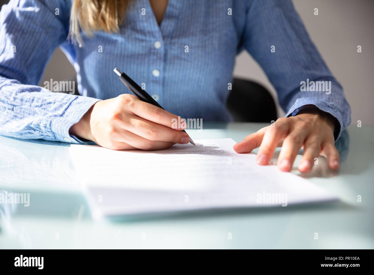 Businesswoman's Hand Signing Contract With Pen Over Desk Stock Photo ...
