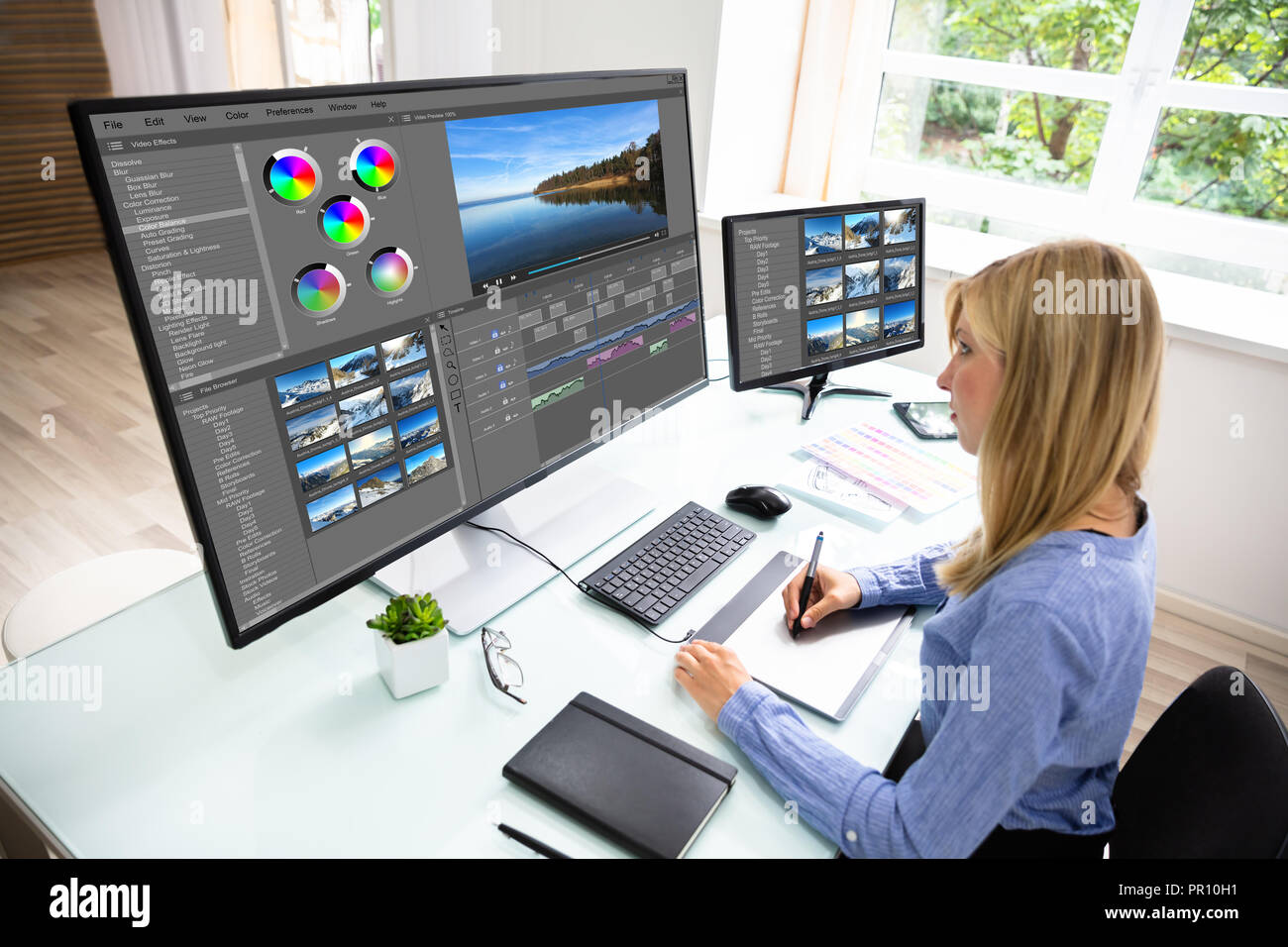 Woman using video editor hi-res stock photography and images - Alamy