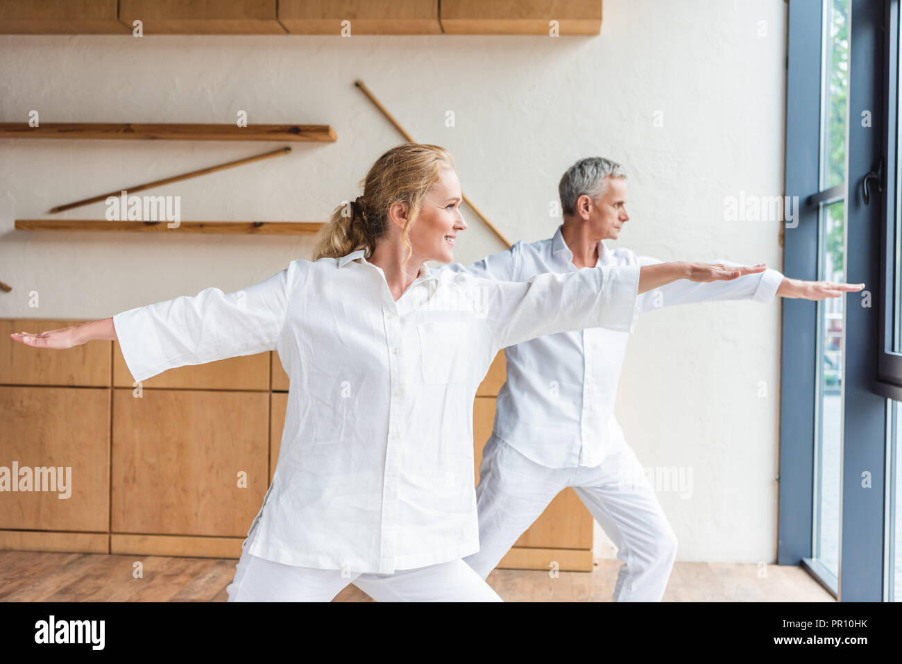 Happy caucasian couple practicing yoga hi-res stock photography and ...