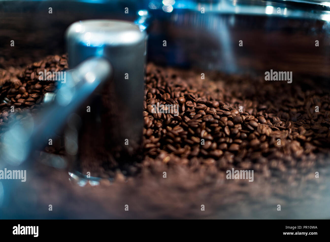 Coffee bean roasting machine. Beans are mixing close up shot Stock ...