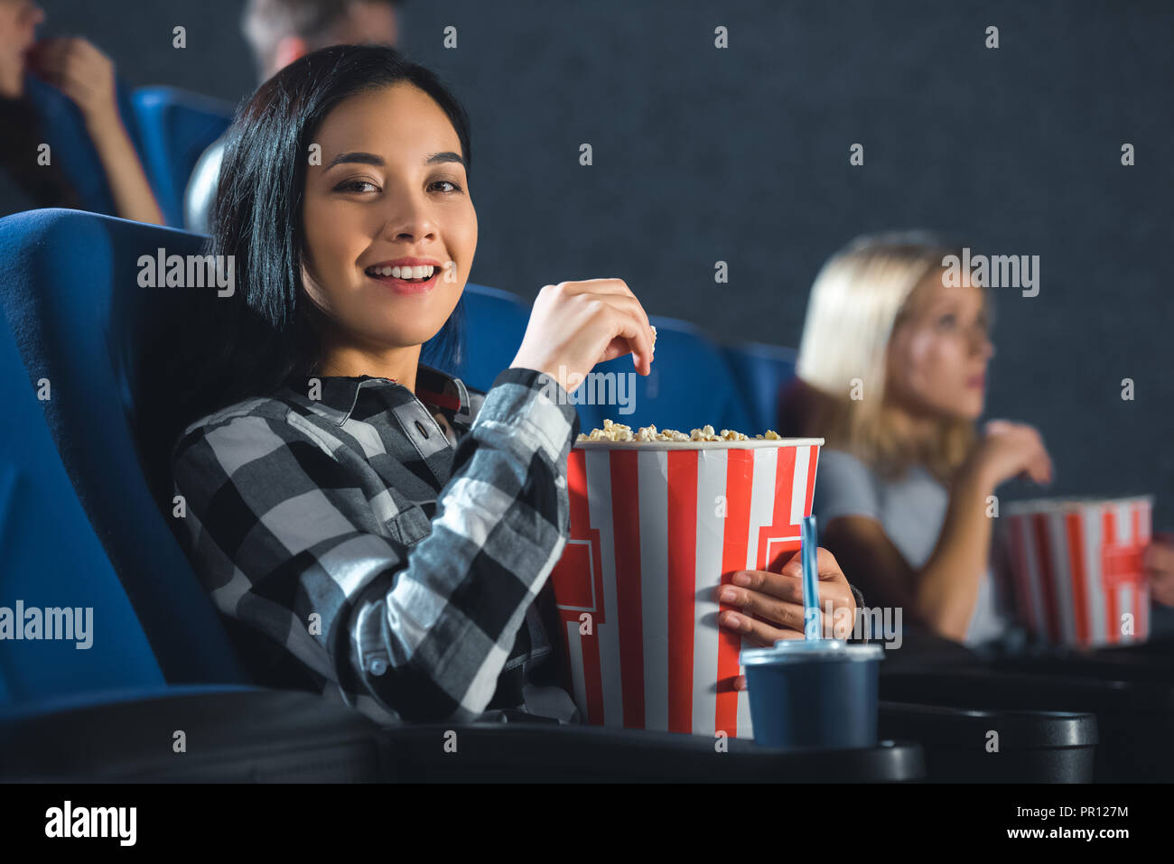 Woman movie theater looking at camera hi-res stock photography and images - Alamy