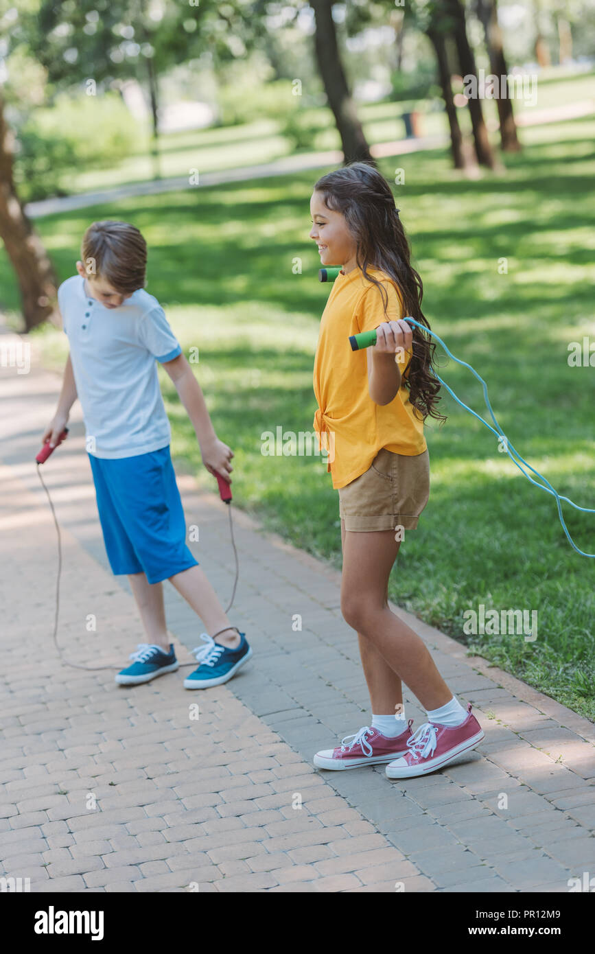 Boy girl skipping ropes hi-res stock photography and images - Alamy
