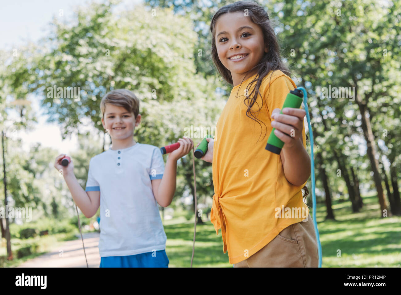 Children skipping park hi-res stock photography and images - Alamy