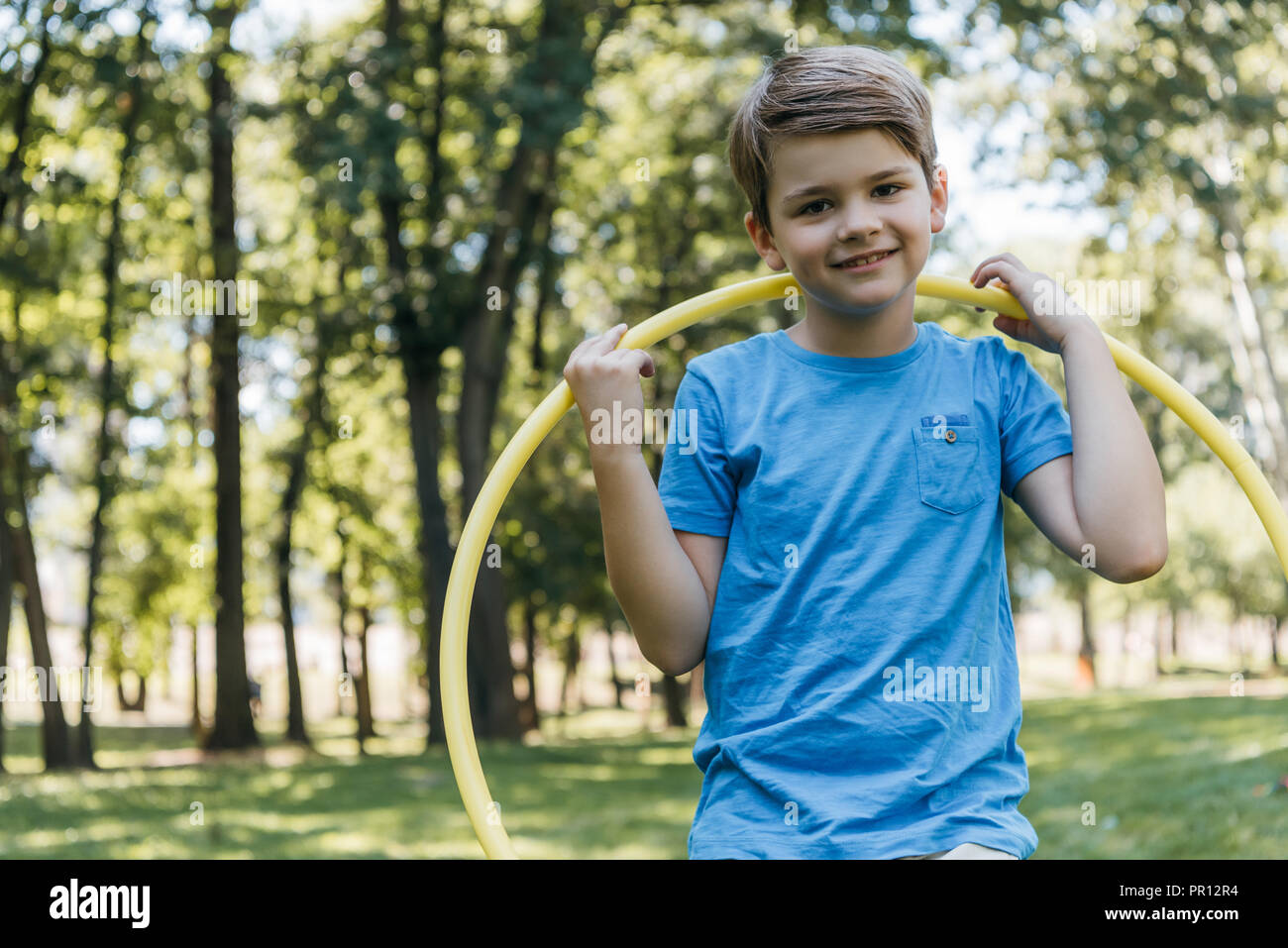 Boy with hula hoop hi-res stock photography and images - Alamy