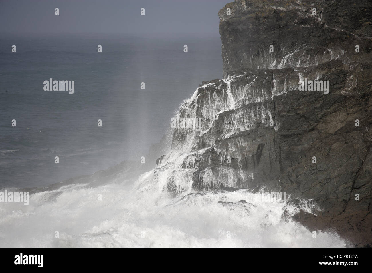 Storm waves engulf Porth Island Newquay Cornwall UK Stock Photo - Alamy