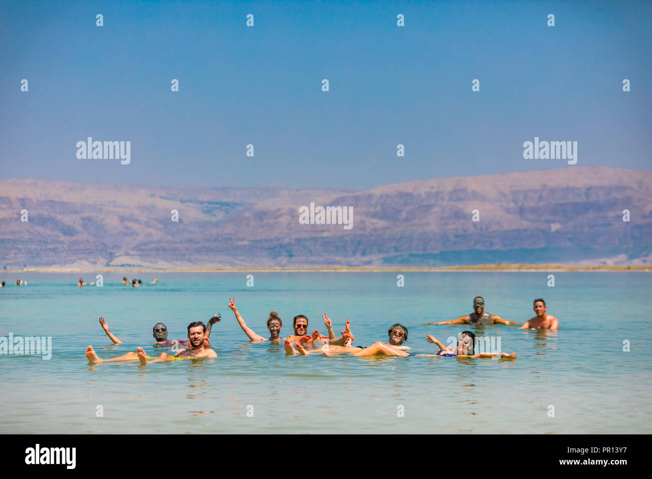 Tourists floating in the dead sea hi-res stock photography and images ...