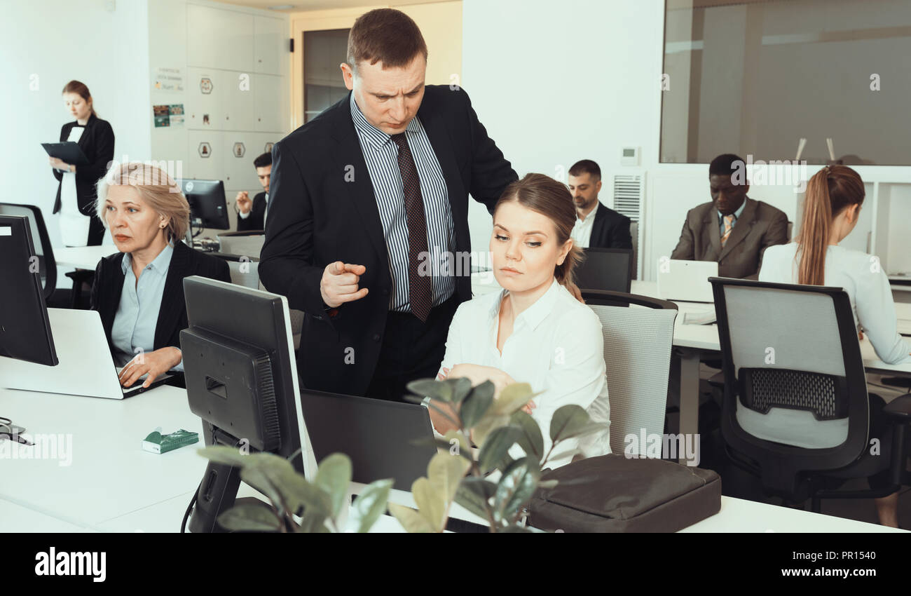 Outraged manager expressing dissatisfaction with work of frustrated ...