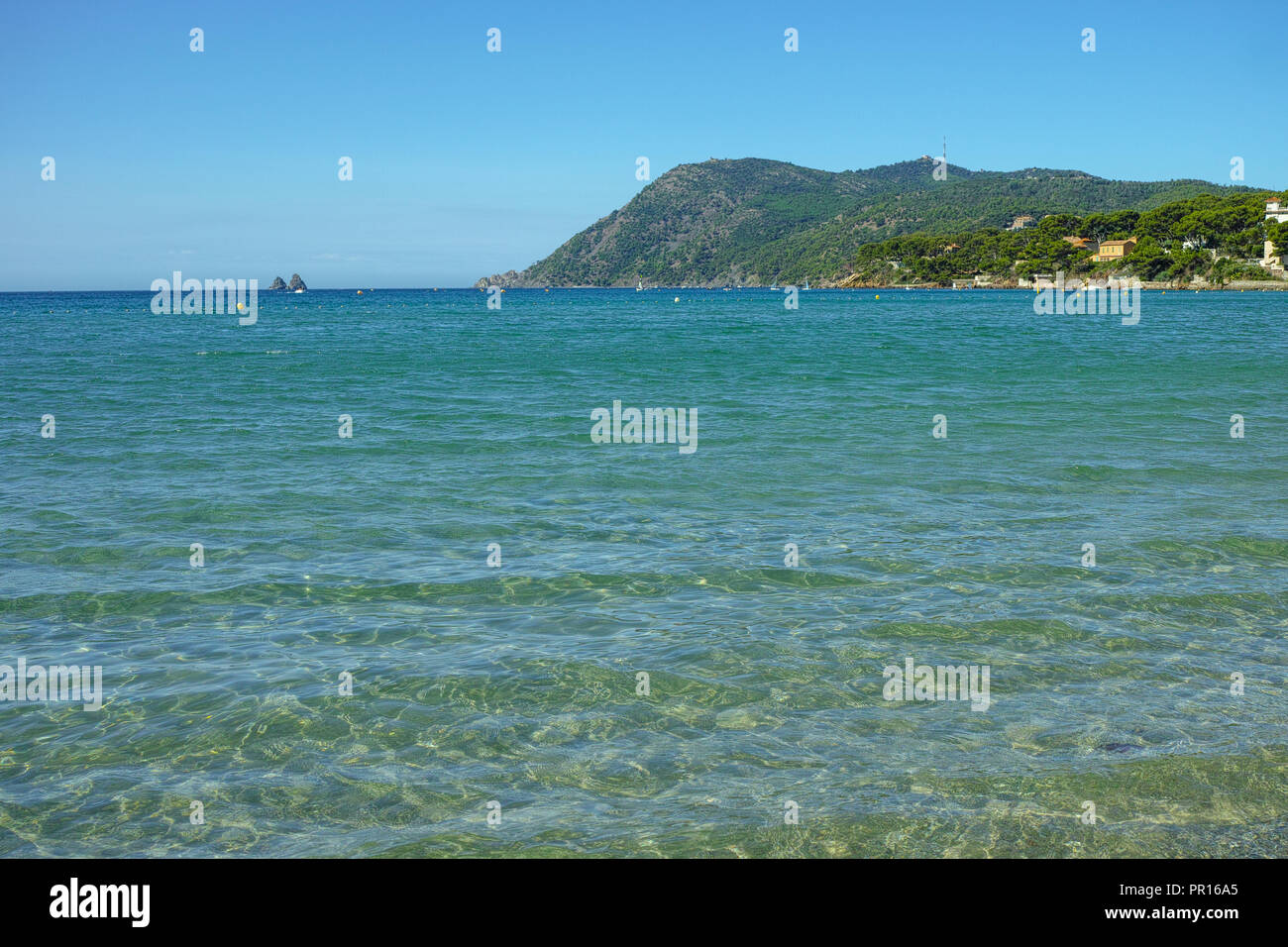 Sunny sandy beach vacation, landscape with clear blue sea shore and ...