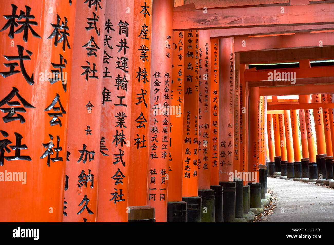 Prayers written in Japanese on the red wooden Torii Gates at Fushimi ...