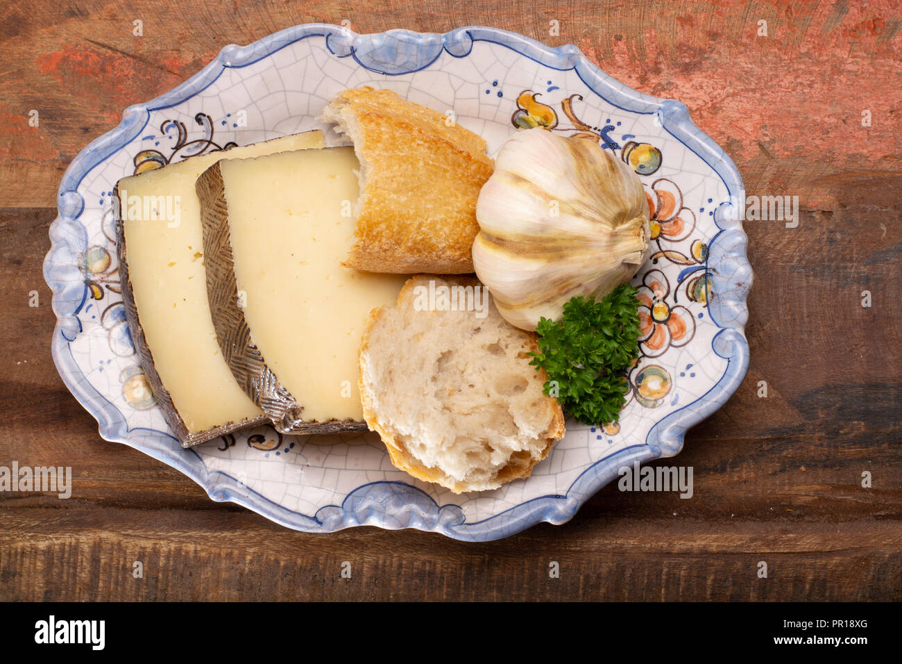 Two pieces of Manchego, queso manchego, cheese made in La Mancha region ...