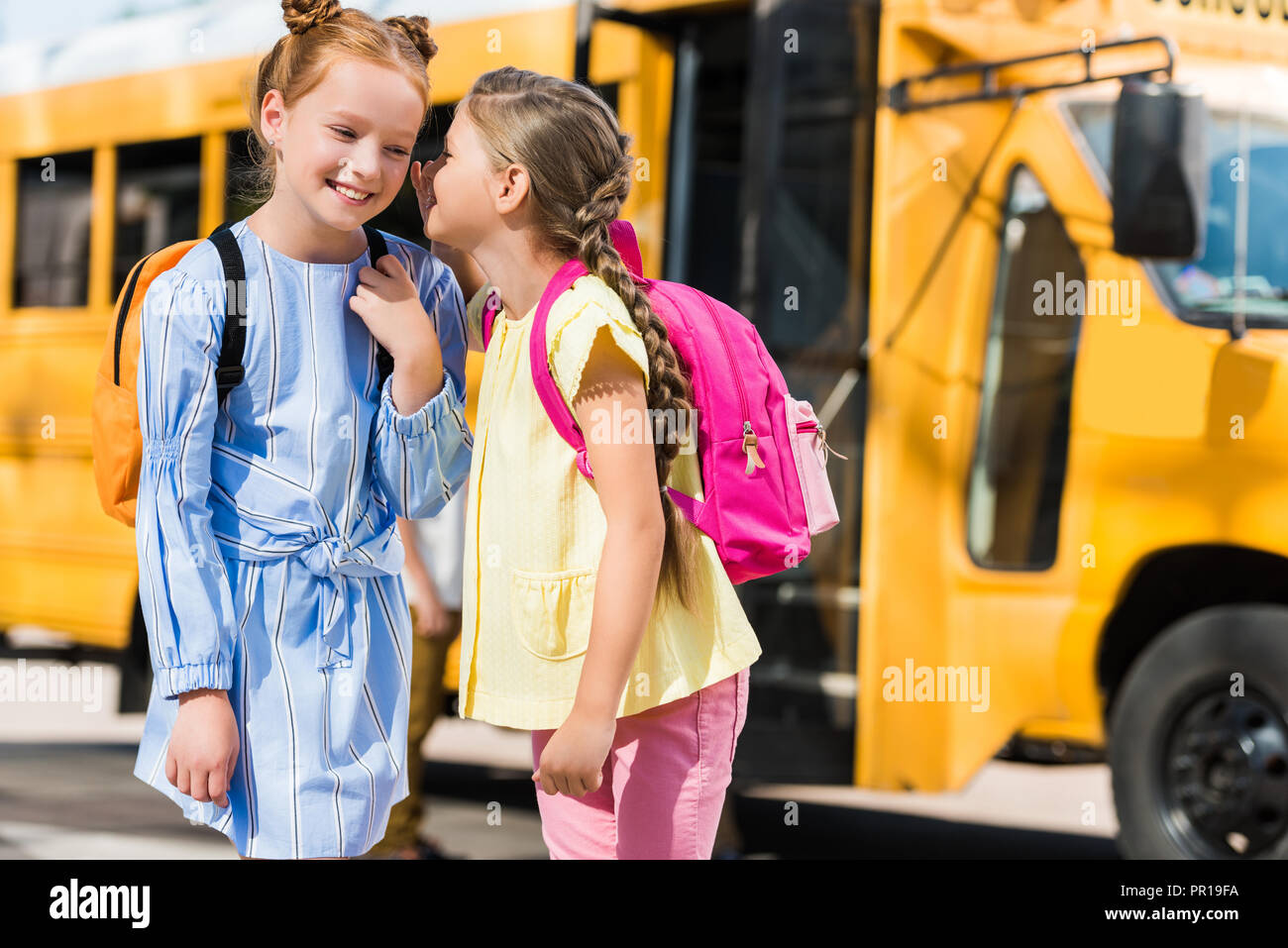 Children talking school bus hi-res stock photography and images - Alamy
