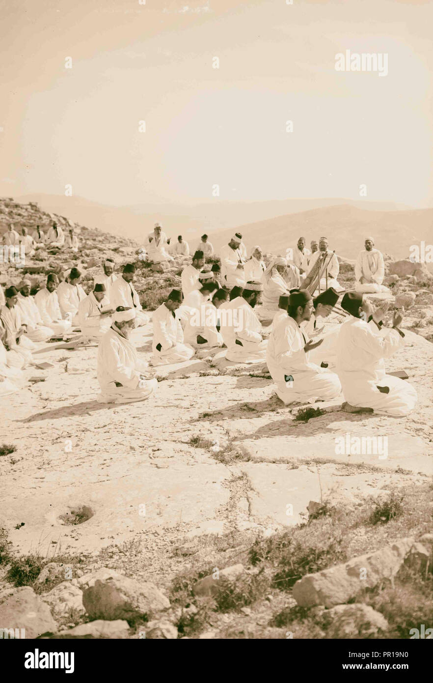 The Samaritan Passover on Mt. Gerizim Prayer on the holy rock, on knees ...