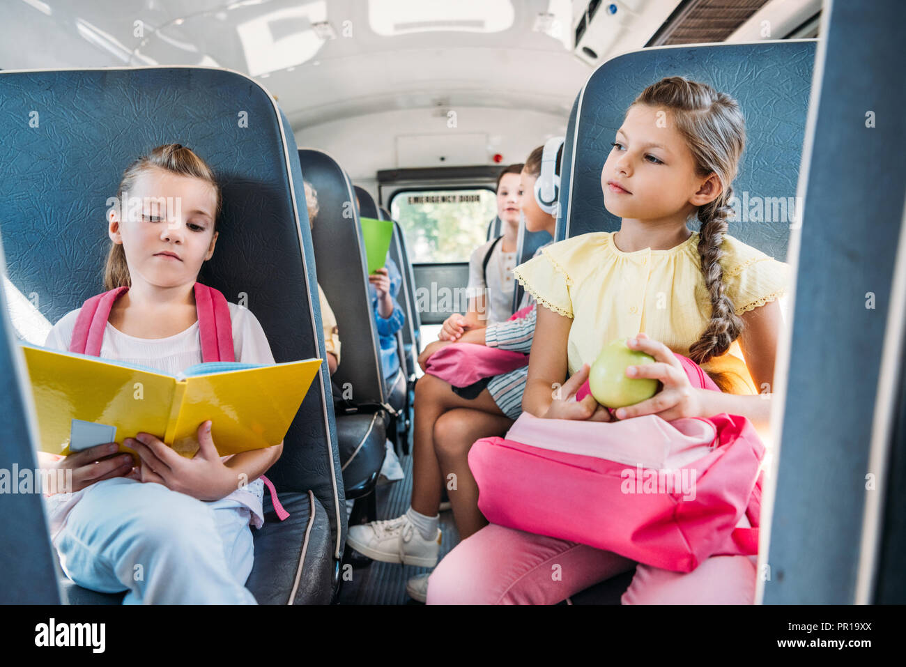 group of pupils riding on school bus during school excursion Stock ...