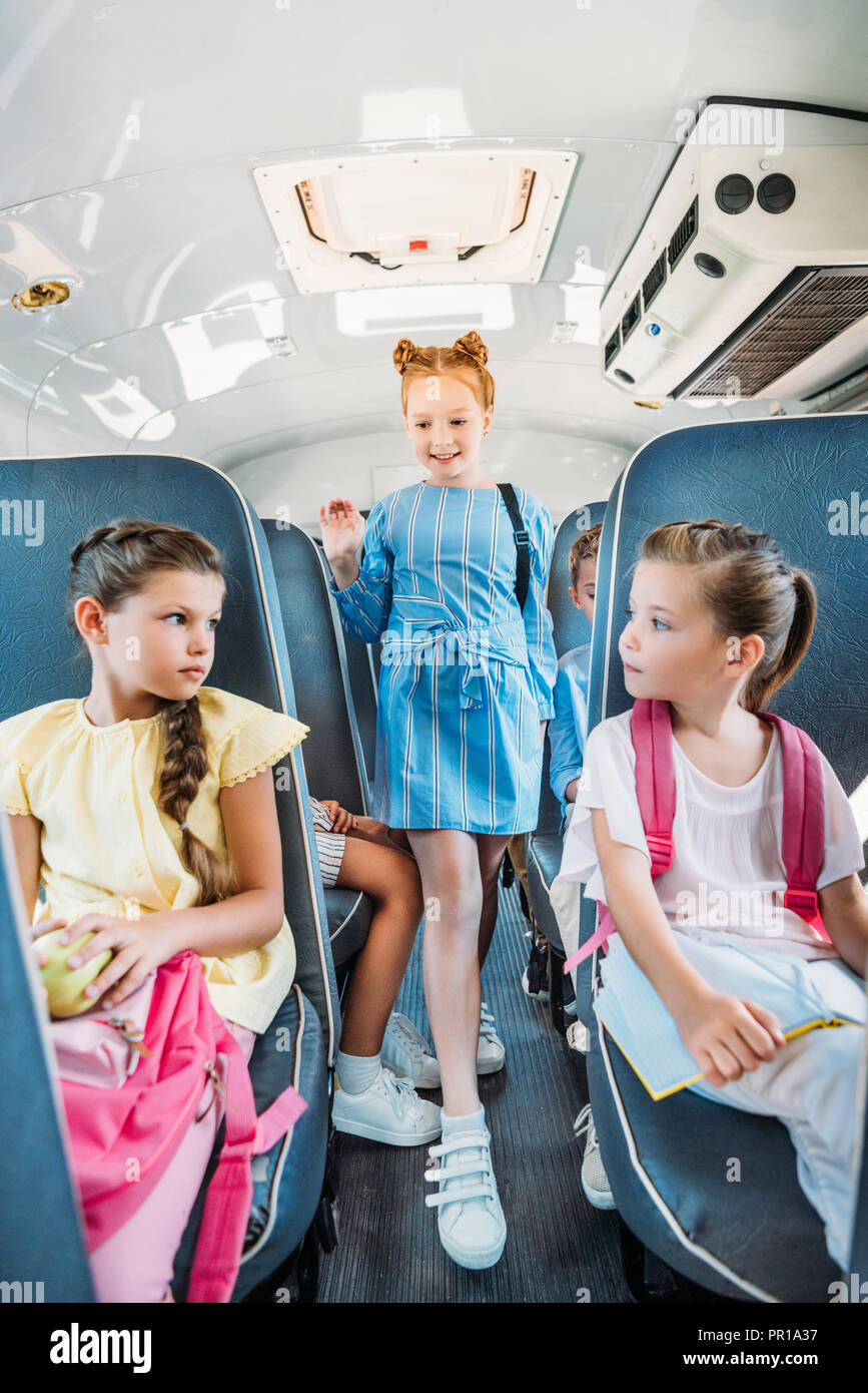 group of elementary age schoolgirls riding on school bus Stock Photo ...