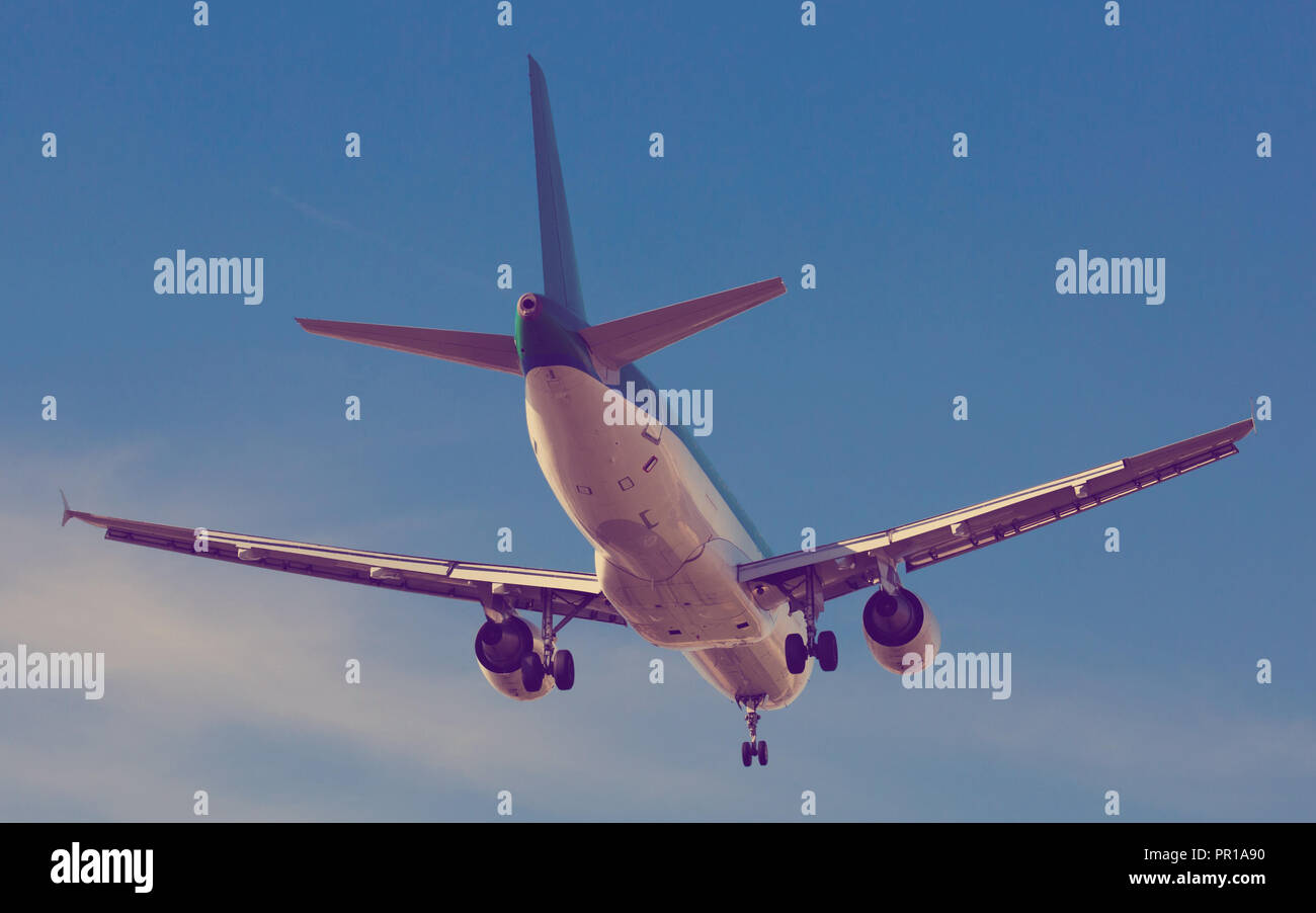 Large passenger airplane taking off from airport during day Stock Photo ...