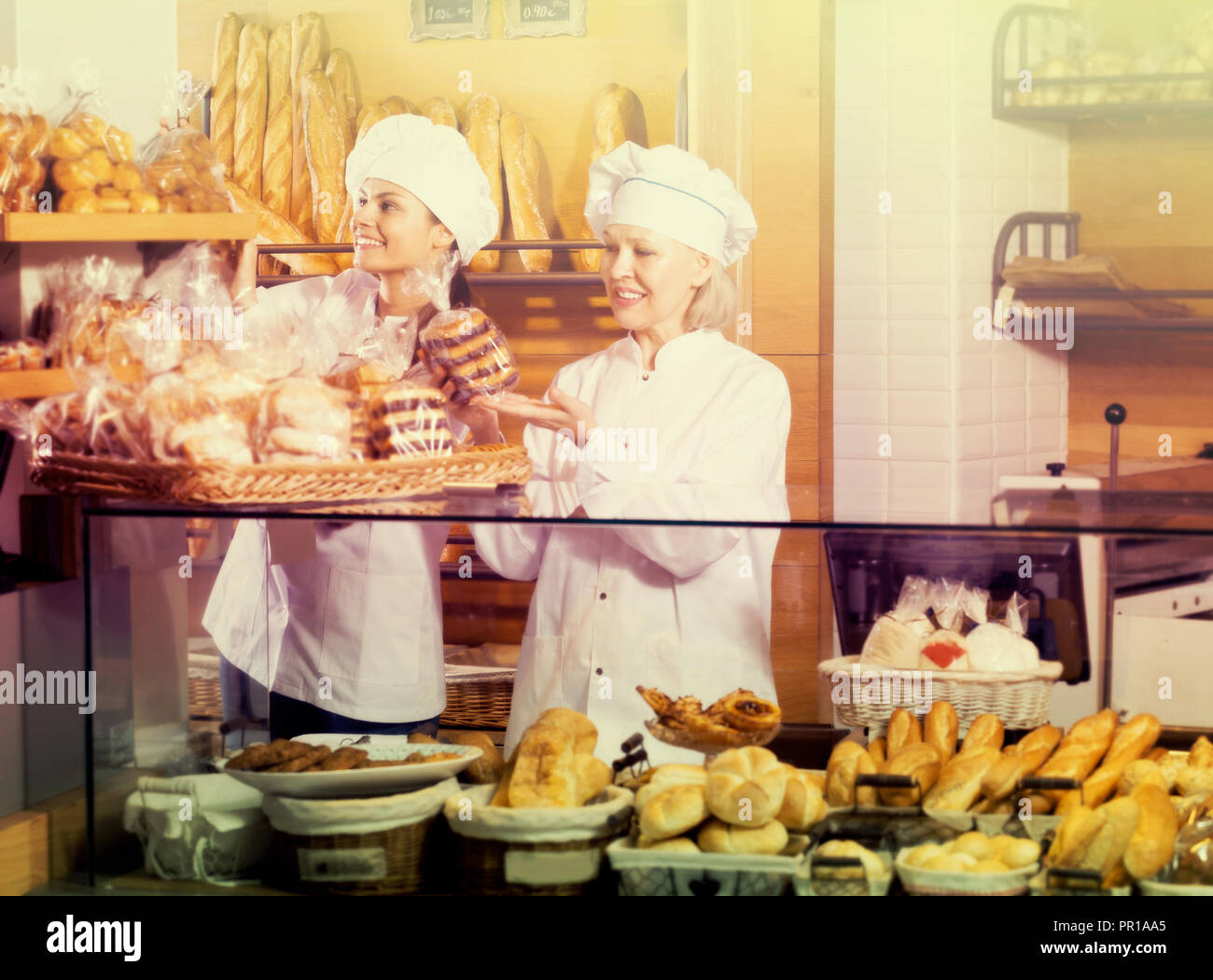 Woman offering bread hi-res stock photography and images - Alamy