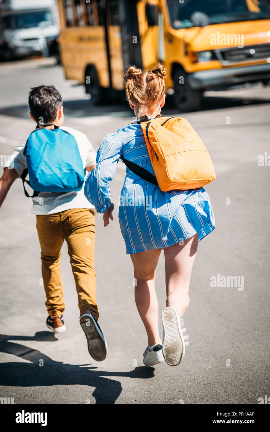 Children running school bus hi-res stock photography and images - Alamy