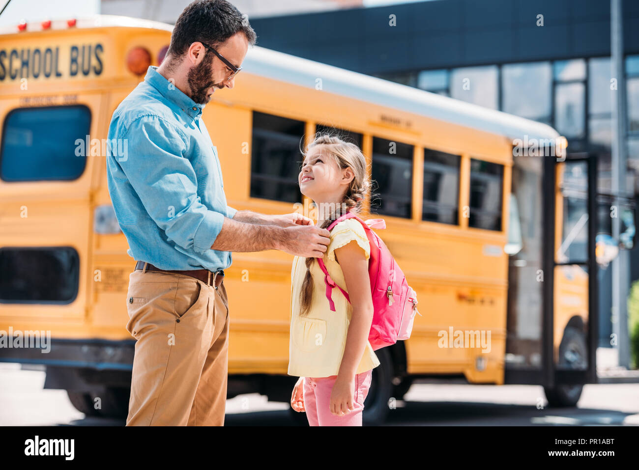 School bus child parent hi-res stock photography and images - Alamy
