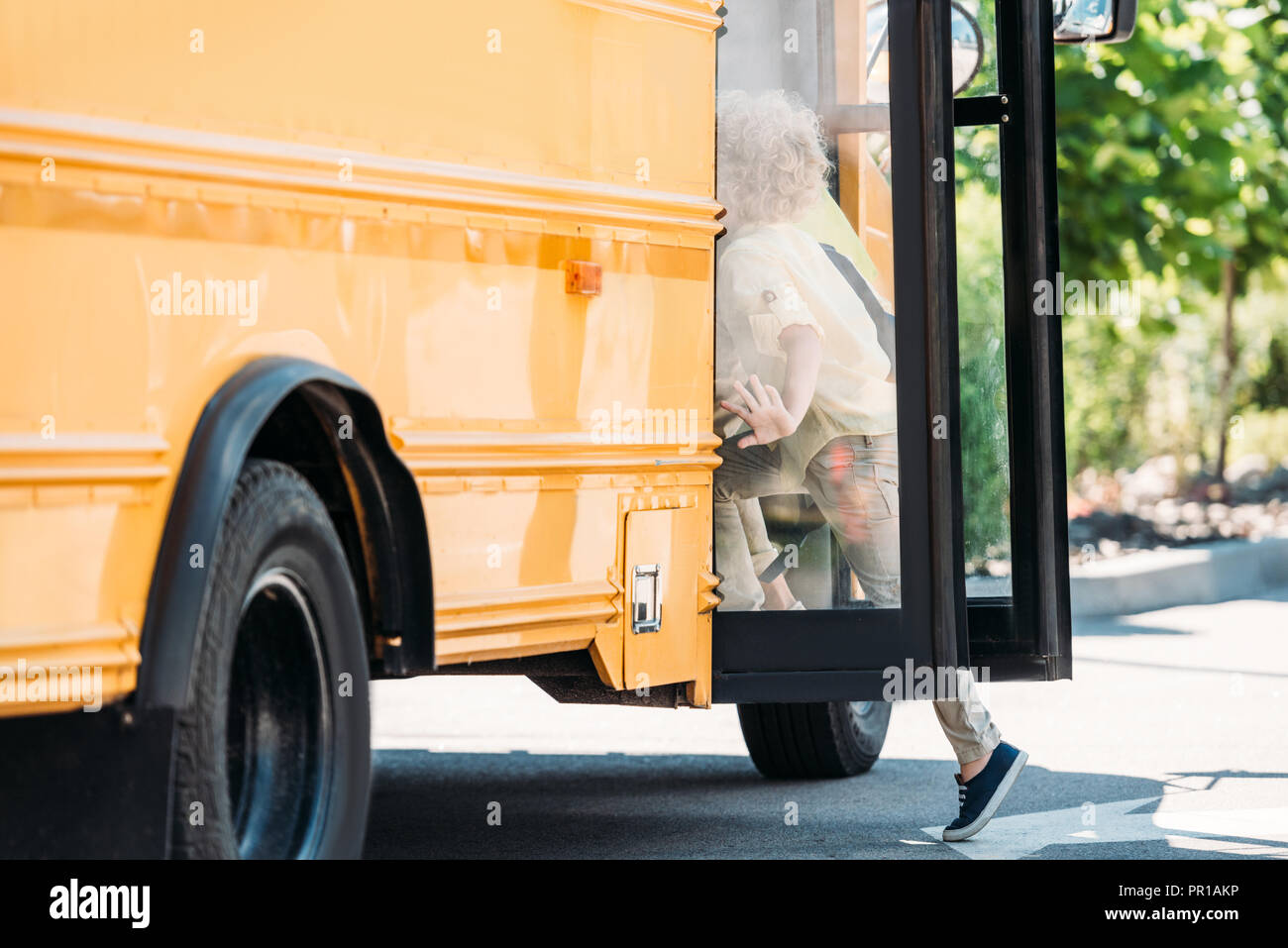 little schoolboys running into school bus Stock Photo - Alamy
