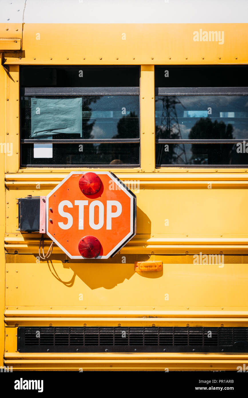 side view of school bus with stop sign Stock Photo - Alamy