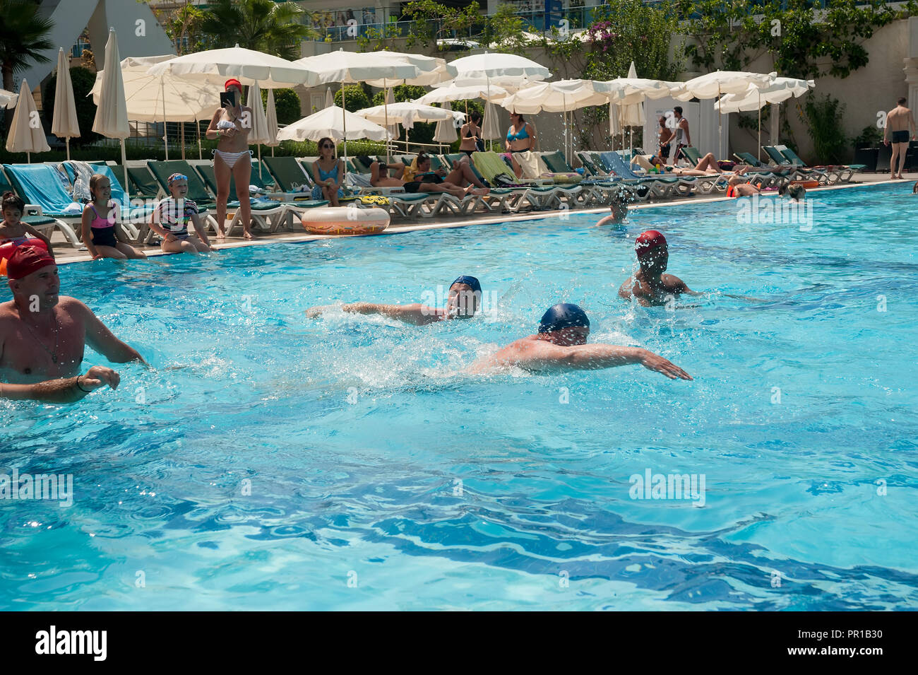 People playing in the pool in a water polo ball Stock Photo - Alamy