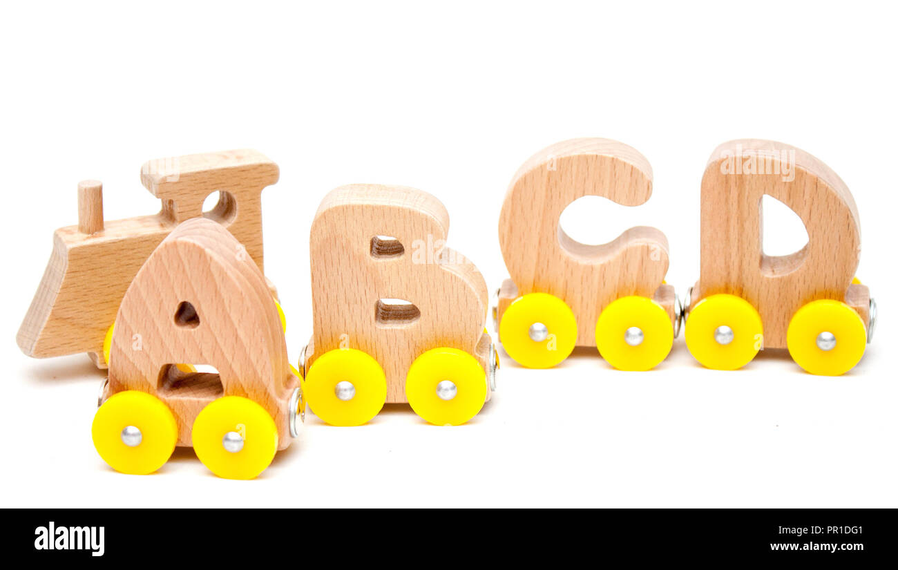Wooden Letters A, B, C, D of a train alphabet and locomotive with ...