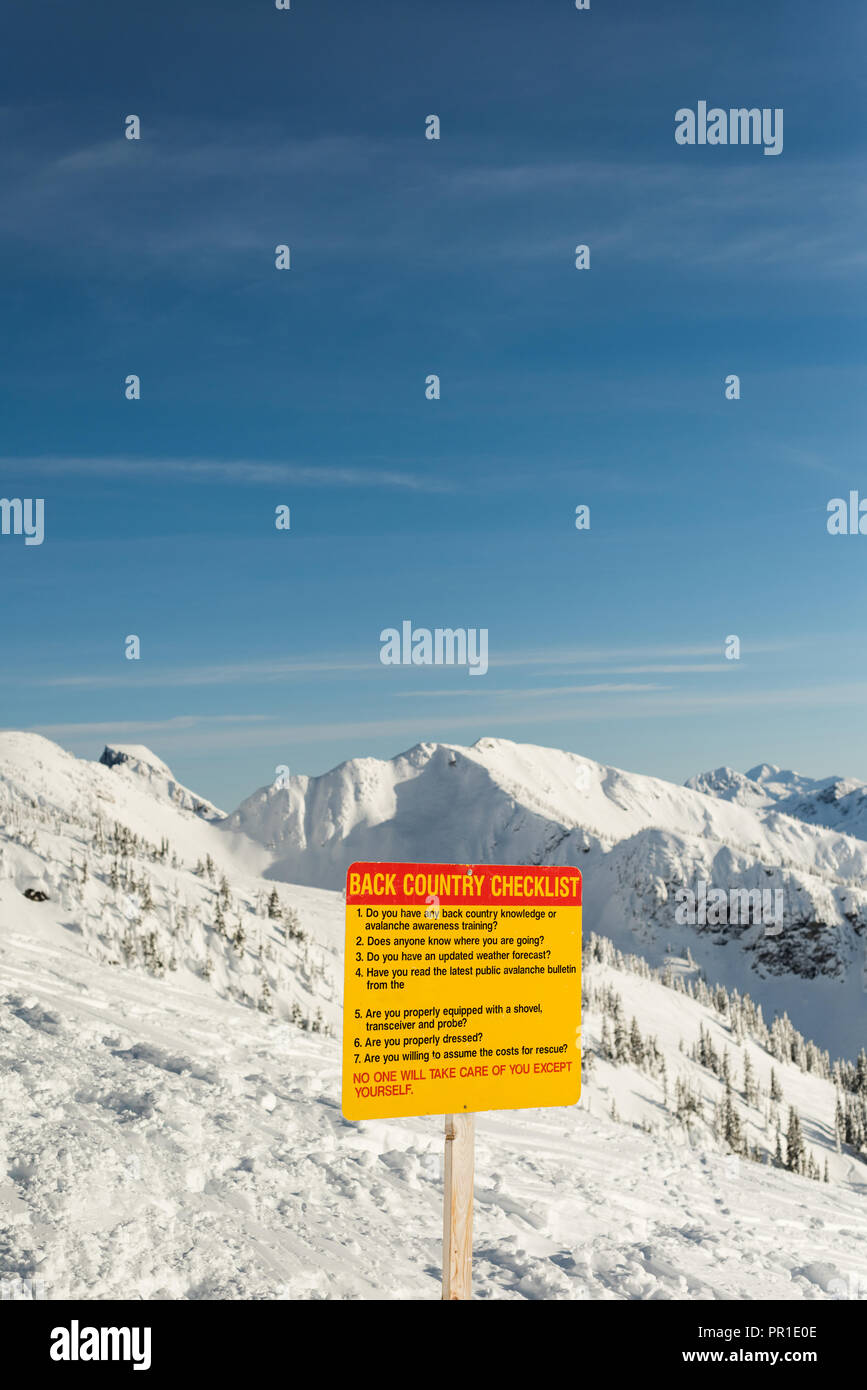 Warning sign on a snowy mountains Stock Photo - Alamy