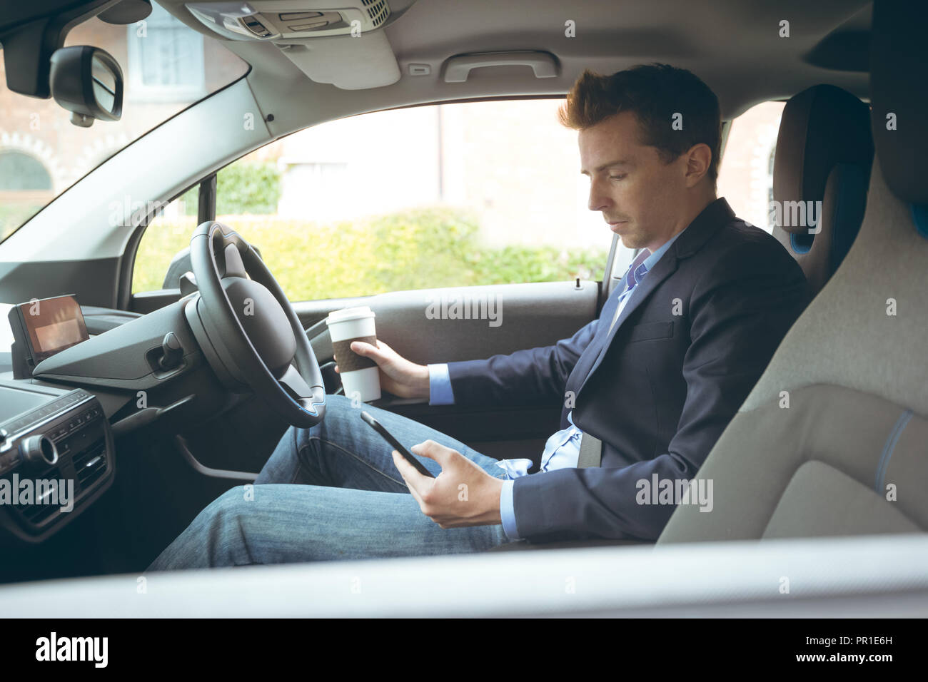 Using mobile phone while driving hi-res stock photography and images ...