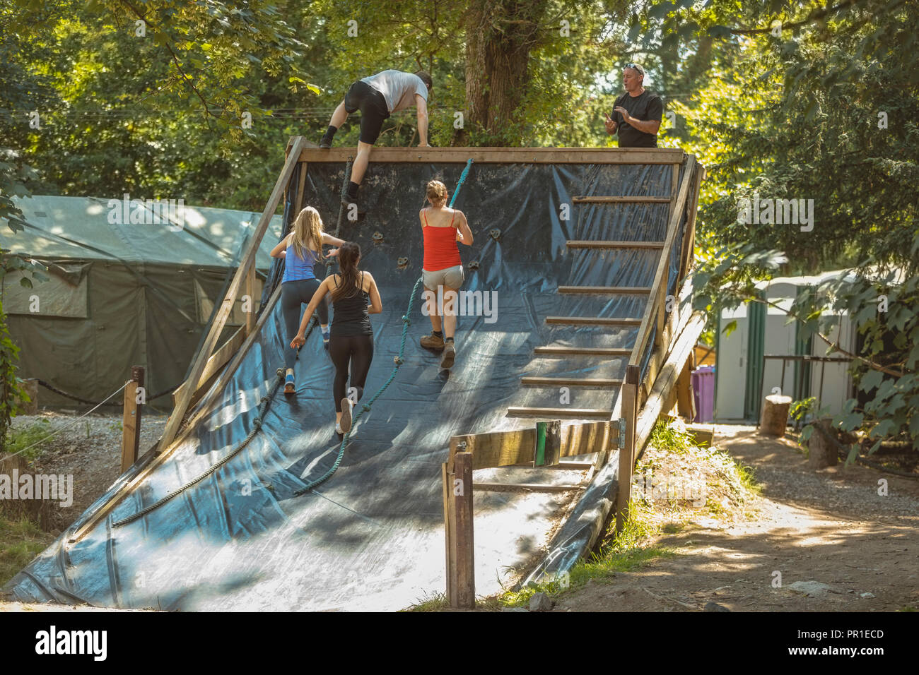 Strong obstacle people climbing hi-res stock photography and images - Alamy