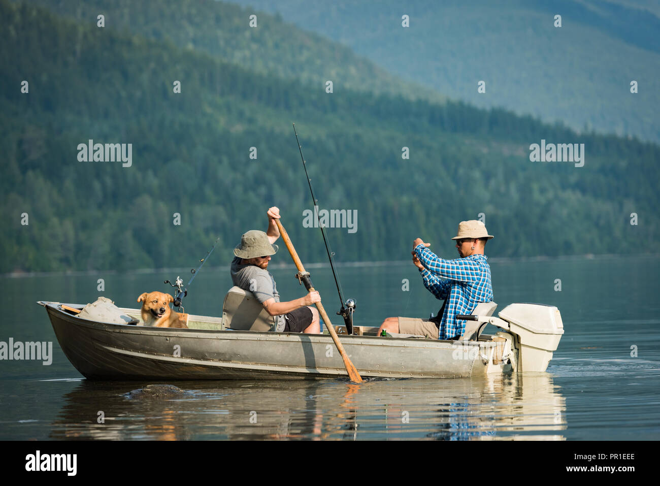 Two fishermen fishing in the river Stock Photo - Alamy